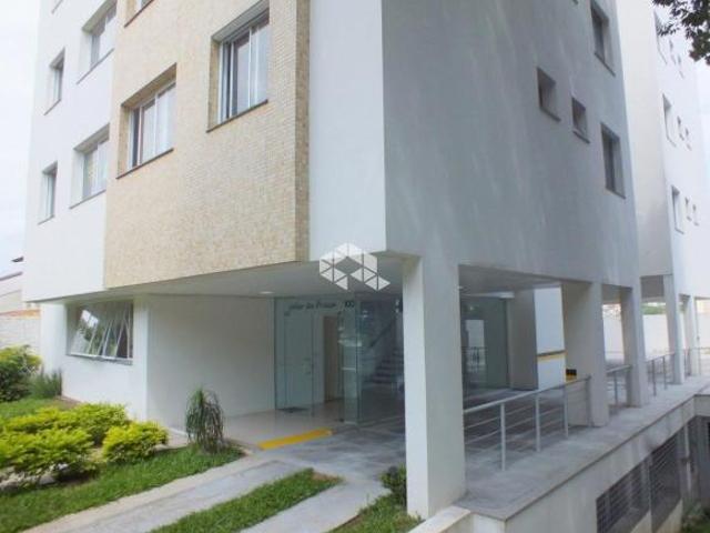APARTAMENTO DOIS DORMITÓRIOS COM SUITE E GARAGEM, EM FRENTE A PRAÇA