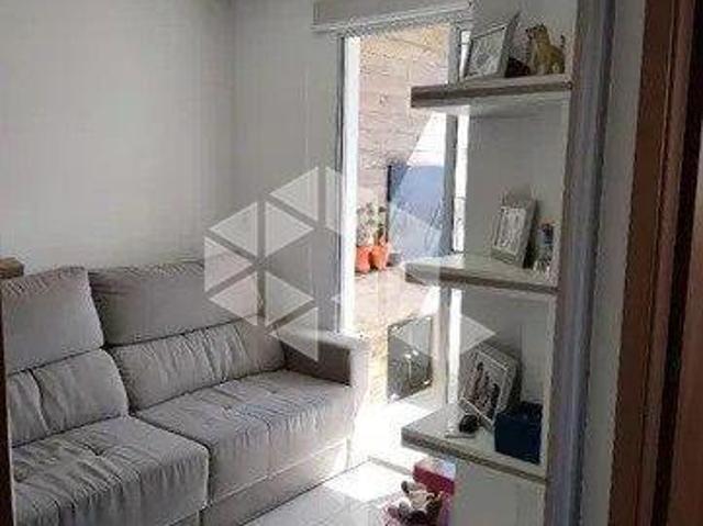 Apartamento dois dormitórios, semi mobiliado com sacada e churrasqueira