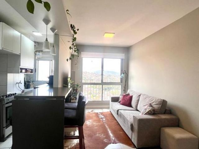 Apartamento dois quartos com churrasqueira e vaga em andar alto