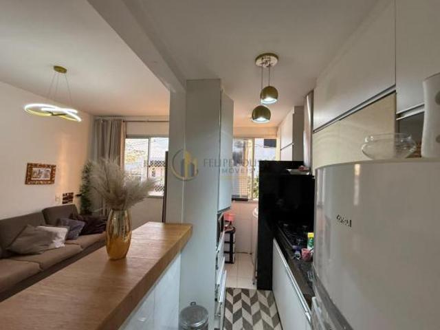 APARTAMENTO EM TORRE UNICA NO GUARUJA MANSÕES 2 QUARTOS 1 SUITE E COZINHA PLANEJADA