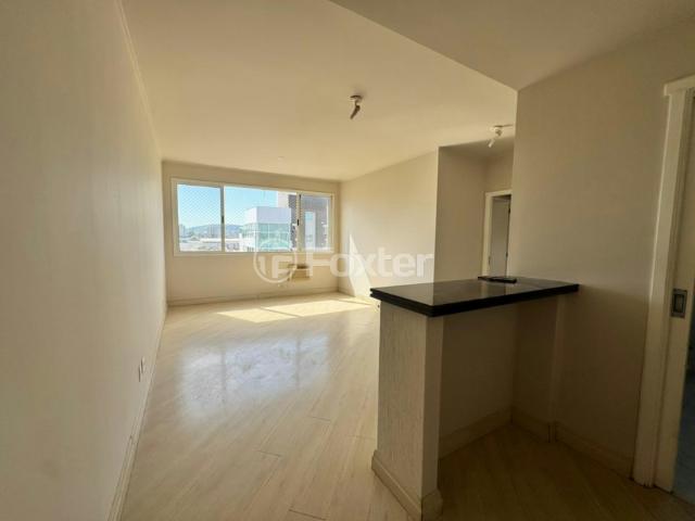 Apartamento em condomínio com 3 dormitórios em Porto Alegre