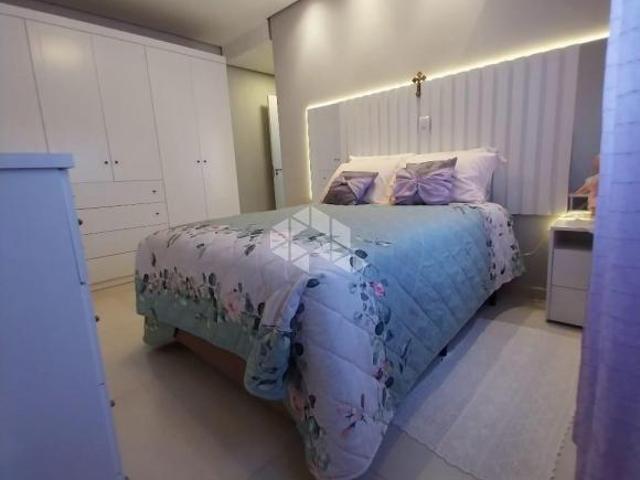 apartamento em ótima localização com dois dormitórios,sala cozinha integrados com churrasqueira e