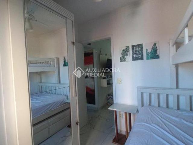 Apartamento em prédio FRENTE MAR em Praia Grande, Vila Mirim