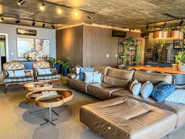 Apartamento exclusivo com 4 suítes living 3 ambientes e piscina com linda vista na Prainha em Torres
