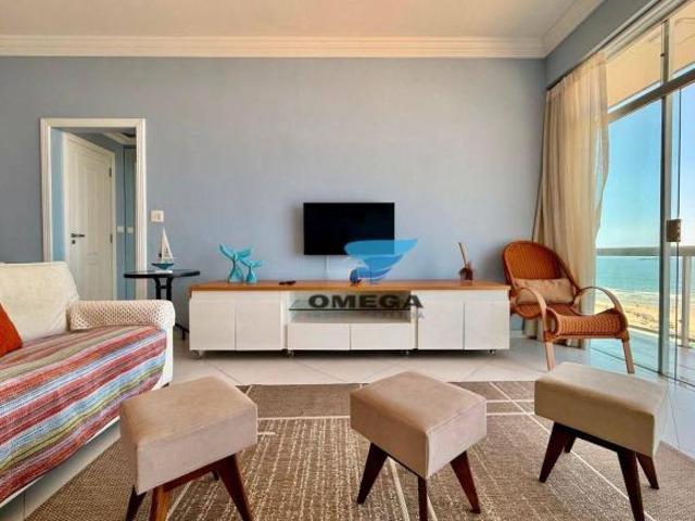 Apartamento frente mar à venda na praia das Pitangueiras no Guarujá I Omega Imoveis
