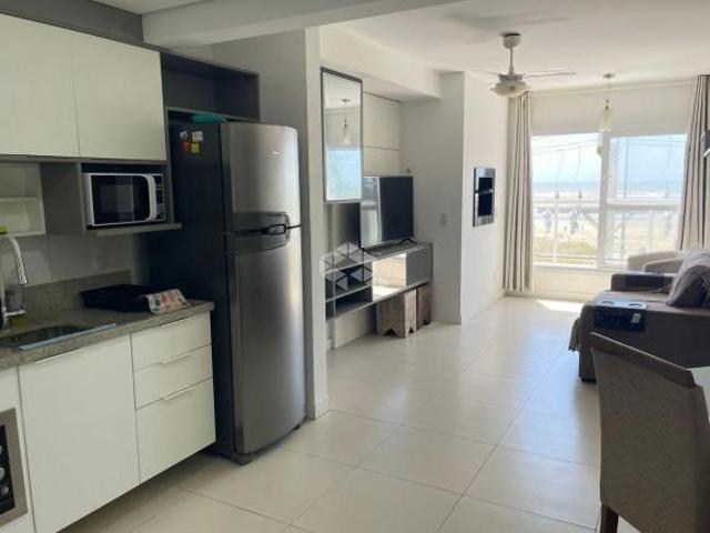 Apartamento frente Mar com 02 dormitórios sendo 01 suíte, mobiliado e decorado, em Capão da Canoa/R