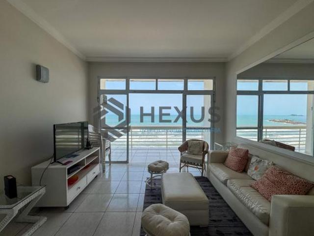 Apartamento frente mar com varanda na Praia das Pitangueiras, Guarujá