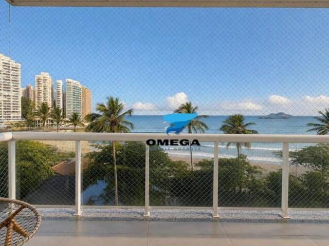 Apartamento frente mar reformado à venda na praia das Pitangueiras no Guarujá I Omega Imoveis