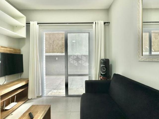 Apartamento mobiliado de 1 dormitório com Vista Mar e box/vaga de garagem em Cap