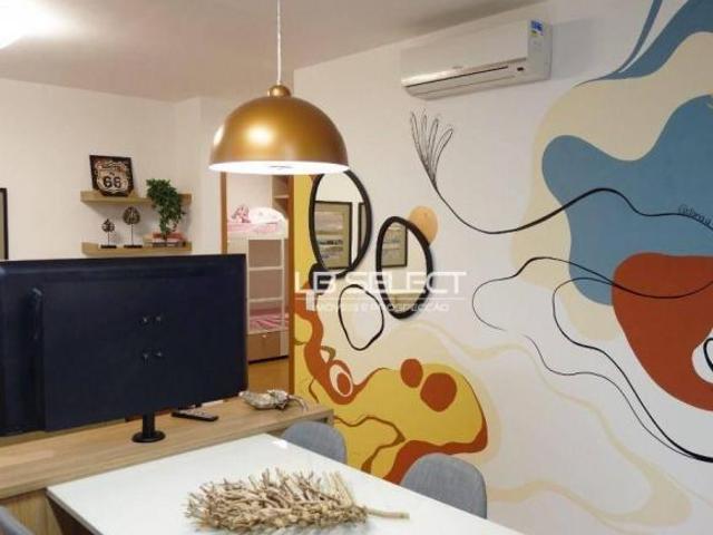Apartamento no bairro Shopping Park com dois quartos, suíte e varanda gourmet