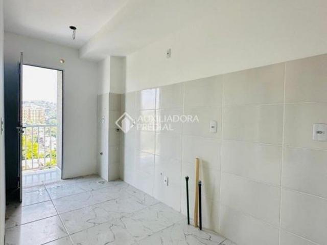 Apartamento no bairro Rondônia em Novo Hamburgo com 2 dormitórios sacada com churrasqueira