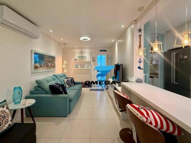 Apartamento novo à venda na praia do Tombo no Guarujá I Omega Imoveis