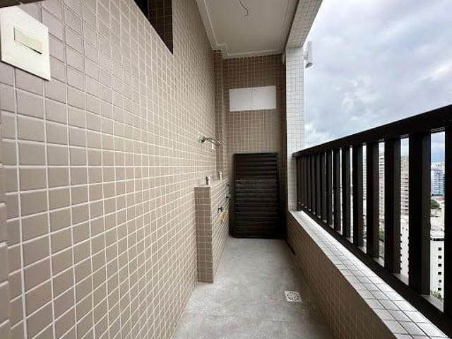 Apartamento novo com 3 quartos e 2 vagas privativas com vista mar no Canto do Forte em Praia Grande