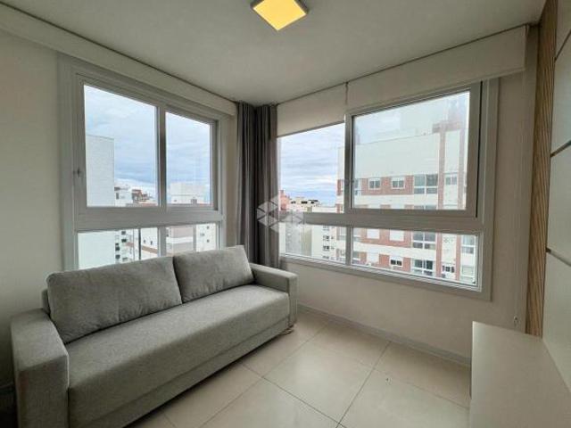 Apartamento novo de 3 dormitórios com 1 suíte mobiliado com box estacionamento no bairro Navegantes