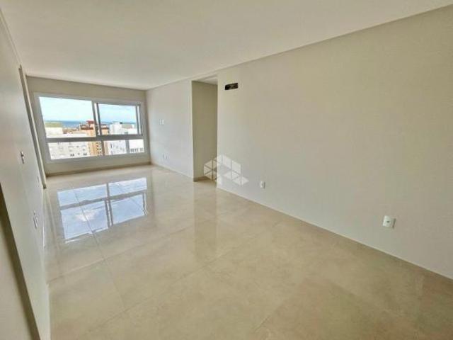 Apartamento novo, 2 dormitórios, box duplo, no centro em Capão da Canoa