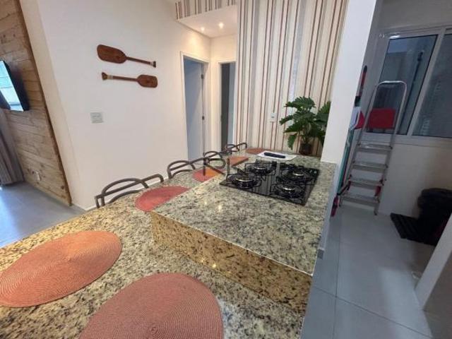 APARTAMENTO PRAIA GRANDE com 2 dormitórios sendo 1 suíte,1 vaga de garagem, varanda gourmet com chur