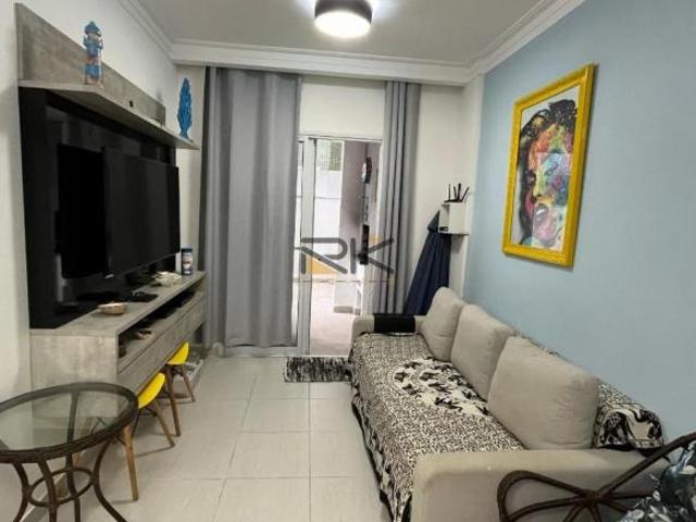 APARTAMENTO PRAIA GRANDE com 2 dormitórios sendo 1 suíte,1 vaga de garagem,sala 2 ambientes,varanda