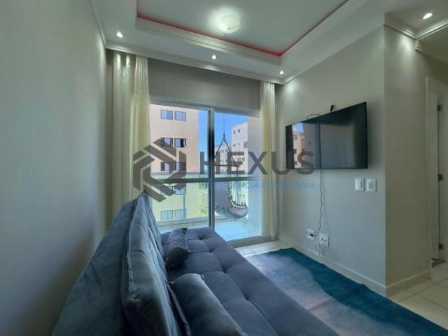 Apartamento reformado com varanda e lazer na Praia da Enseada, Guaruja