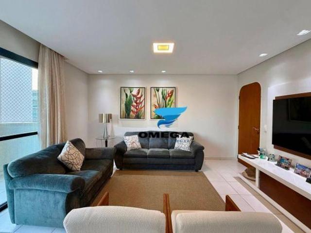 Apartamento reformado à venda na praia das Pitangueiras no Guarujá I Omega Imoveis