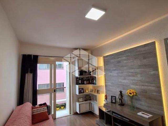 Apartamento semi mobiliado com 64 m², 2 quartos, sacada e vaga coberta no bairro Nossa Senhora das G