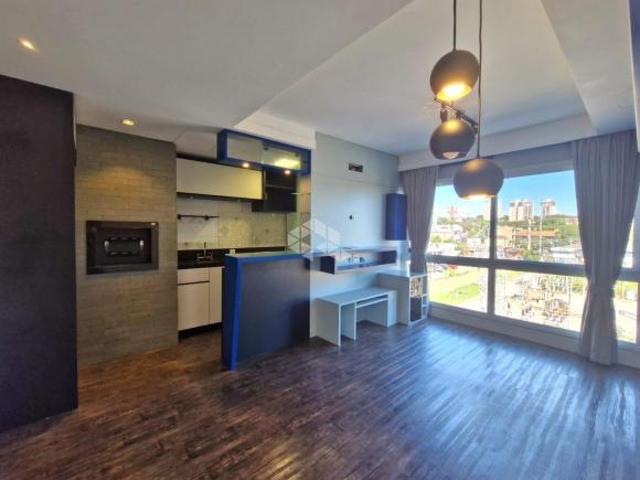 Apartamento semi mobiliado de 2 dormitórios com suíte e 3 vagas de garagem no bairro Passo da Areia