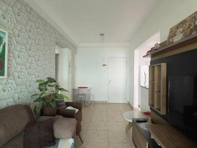 Apartamento semi mobiliado em Mongaguá, prédio frente mar, 2 quartos, suíte e vista lateral mar
