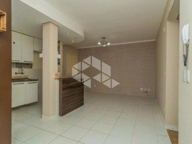 Apartamento semimobiliado com 2 dormitórios, churrasqueira integrada, vaga escriturada
