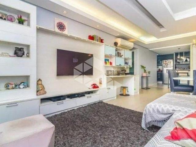Apartamento semimobiliado com 2 dormitórios, sendo 1 suíte e 2 vagas no bairro R