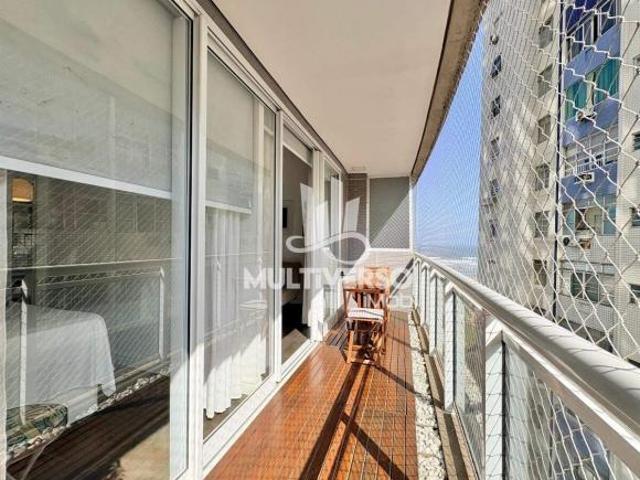 Apartamento studio 1 dormitorio com varanda vista lateral mar lazer completo frente praia Pompéia em