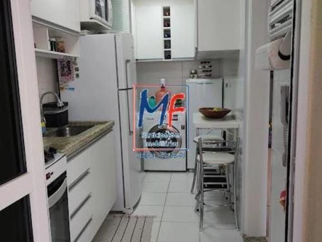 Apto à venda em Guarujá com 72 m² de área útil, 2 quartos, 2 banheiros, varanda gourmet com churrasq