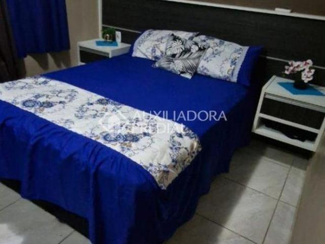 Auxiliadora vende casa com 2 quartos, churrasqueira e piscina em Nova Santa Rita!