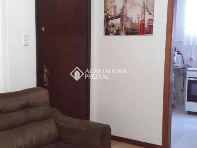 AUXILIADORA PREDIAL, VENDE: Apartamento 2 dormitórios, sala de estar, cozinha, área de serviço e ban