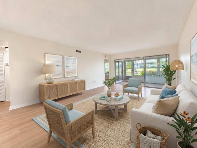AVAILABLE NOW! Beautifully Renovated First Floor Condo with Peaceful Screened Lanai
