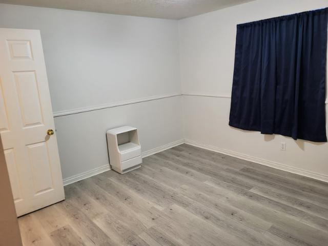 basement bedroom, shared living spaces