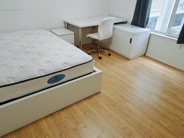 BEDROOM WITH PRIVATE BATH IN A NEUTRAL DECOR CON