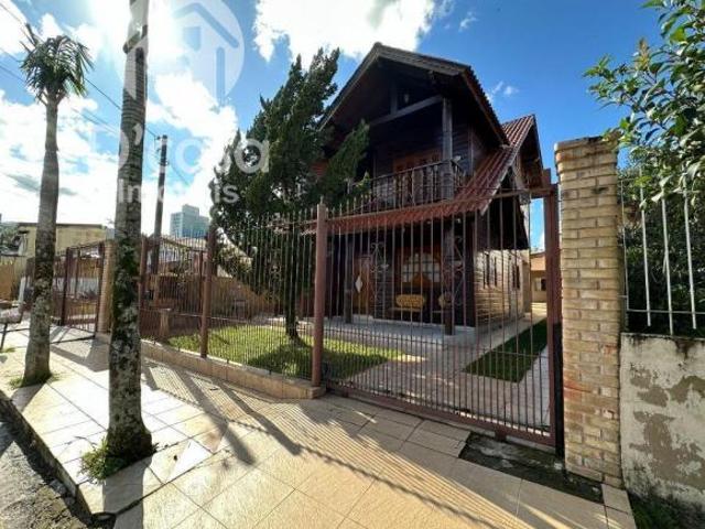 Belíssima casa com 4 dormitórios à venda, 223 m² por R$ 650.000 Centro Gravataí/RS