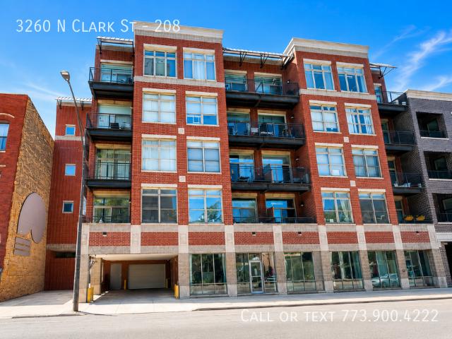 Boutique Lakeview Loft 2bed/2bath with Soaring Concrete Ceilings 20x20 Private Patio and garage parking Inlcuded