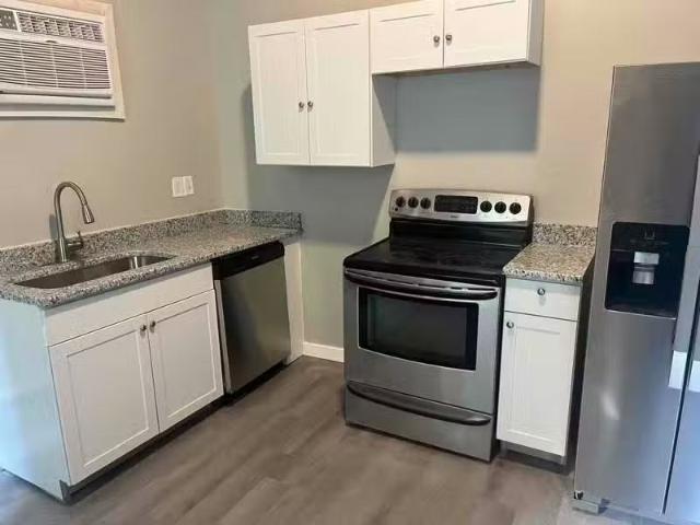 Brand new studio unit with granite countertops and stainless s.