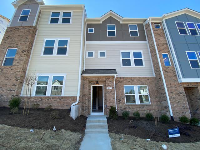 Brand new townhome. Downstairs, the versatile flex space makes a great office or optional guest suite. Other features include a large kitchen island and furnished living room/dining room.