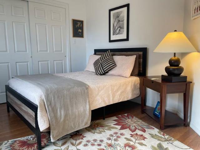 Bright and cozy bedroom with an attached bathroom
