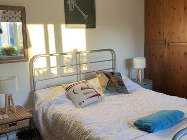 Bright bedroom in pretty attic flat