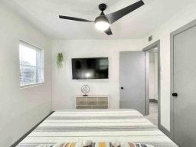 Bright room with shared bathroom and full access
