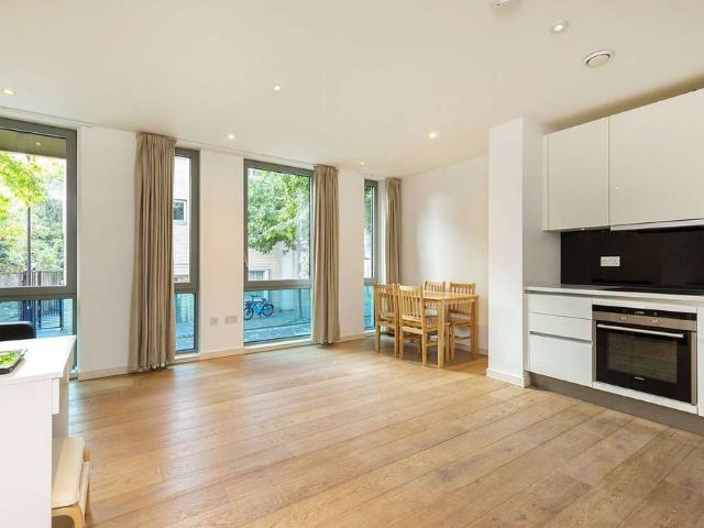 Bright two double bedroom flat with wooden floors and high standard fixtures in an extremely popular small new development on a side street near King's Cross