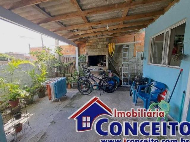 C91 Residência com anexo localizada em região de moradores