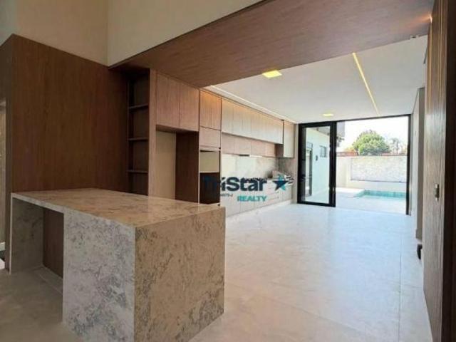 CA0659 CASA TÉRREA COM ACABAMENTO UNICO 03 SUÍTES E PISCINA EM CONDOMINIO ALTO PADRÃO AT. 360m²