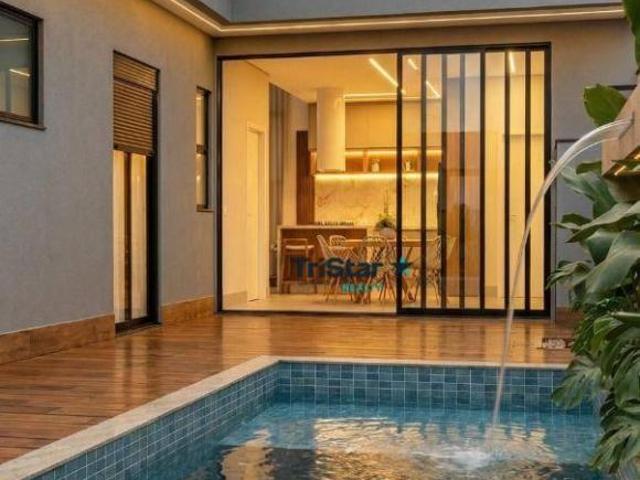 CA0681 LINDISSIMA CASA Á POUCO TEMPO DA ENTREGA POSSUI 03 SUITES PISCINA E ESCRITORIO EM CONDOMINI