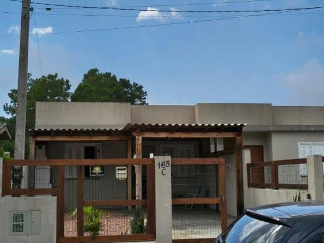 Casa na praia com 2 dormitórios e vaga — aceita troca por apartamento em Porto A