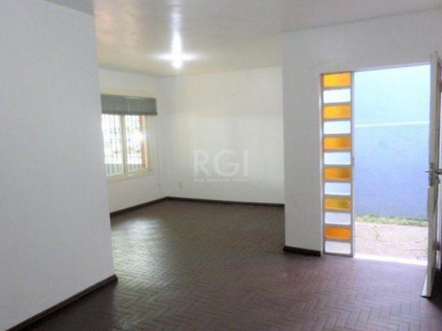 Casa no bairro Jardim Botânico de 3 dormitórios e 2 vagas