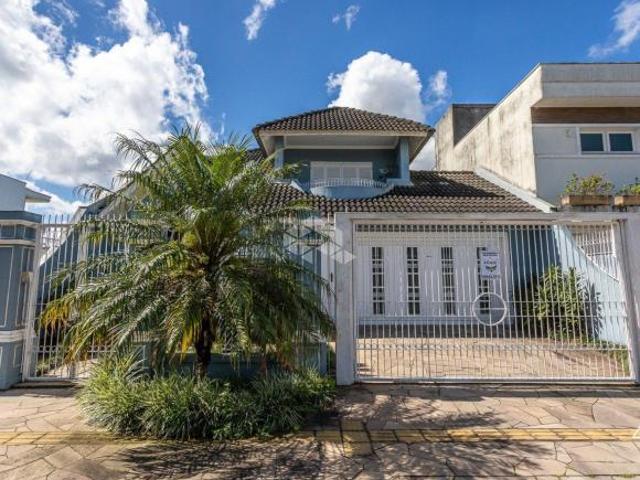 Casa no bairro Marechal Rondon, com 4 dormitórios sendo 2 suítes, piscina. Aceita financiamento