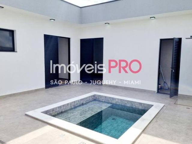 Casa nova a venda em condominio em Indaiatuba com piscina, jardim, churrasqueira, 3 suites e 4 vagas